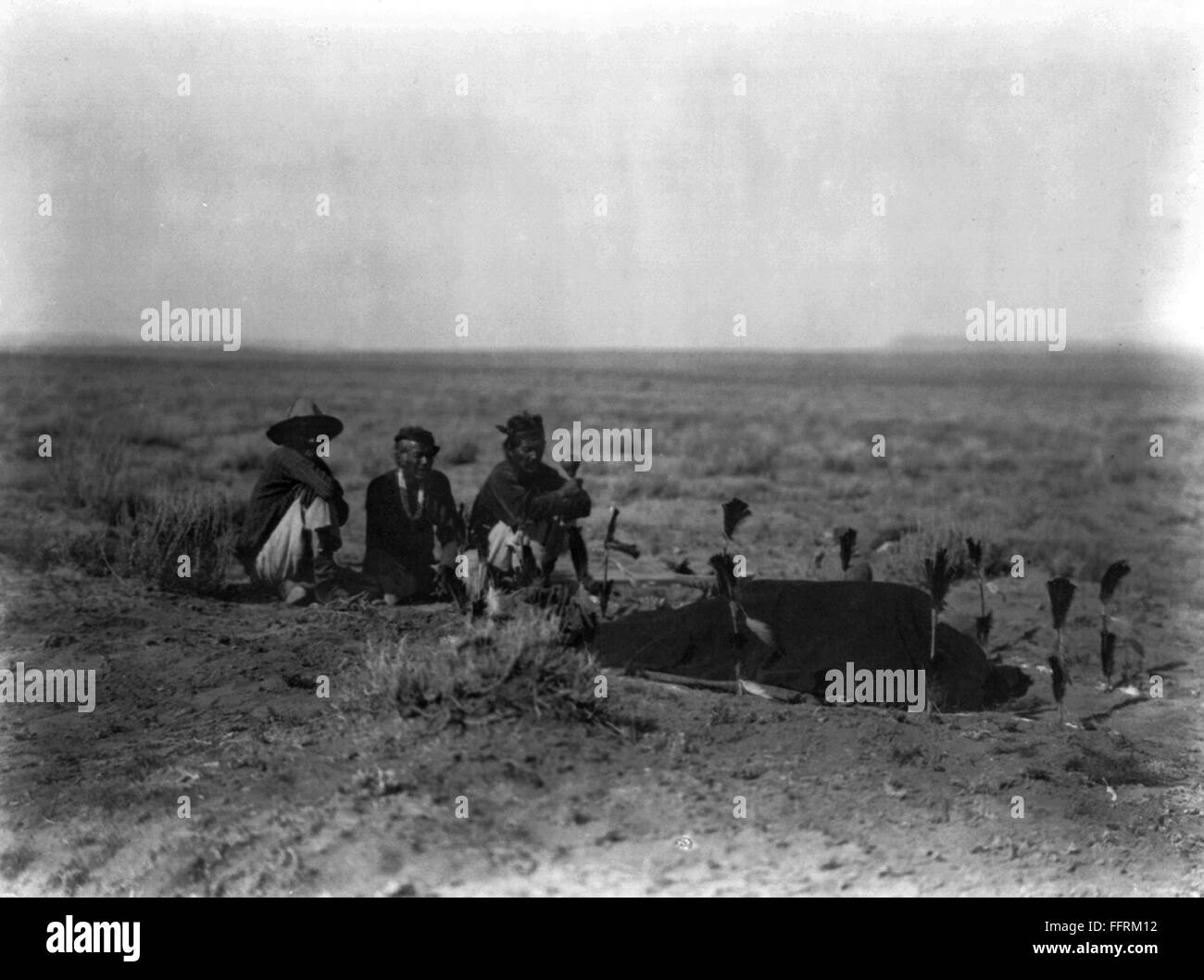 NAVAJO CEREMONY, c1905. /nThree seated Navajo men performing part of a ...