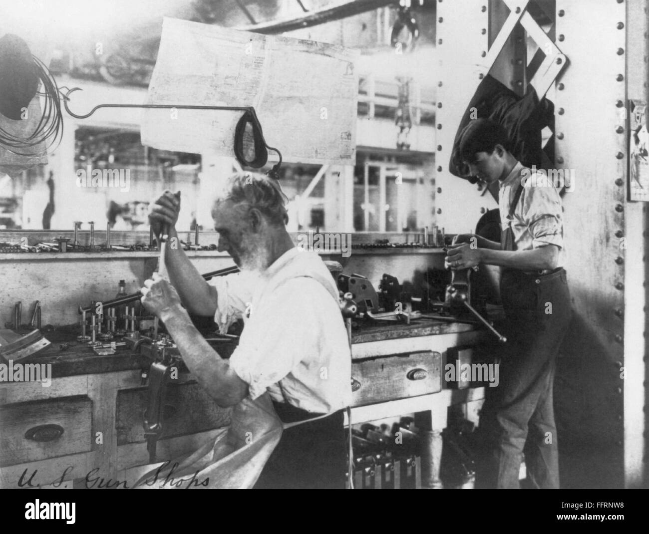 U.S. NAVAL GUN FACTORY, 1903. /nTwo men at work at the U.S. Naval Gun ...
