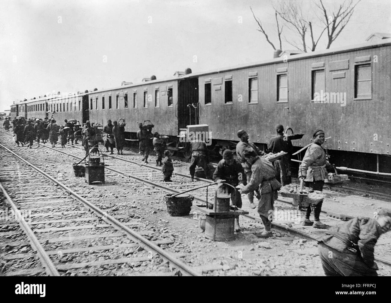 CHINA: RAILROAD STATION. /nA Chinese railroad station with a train ...