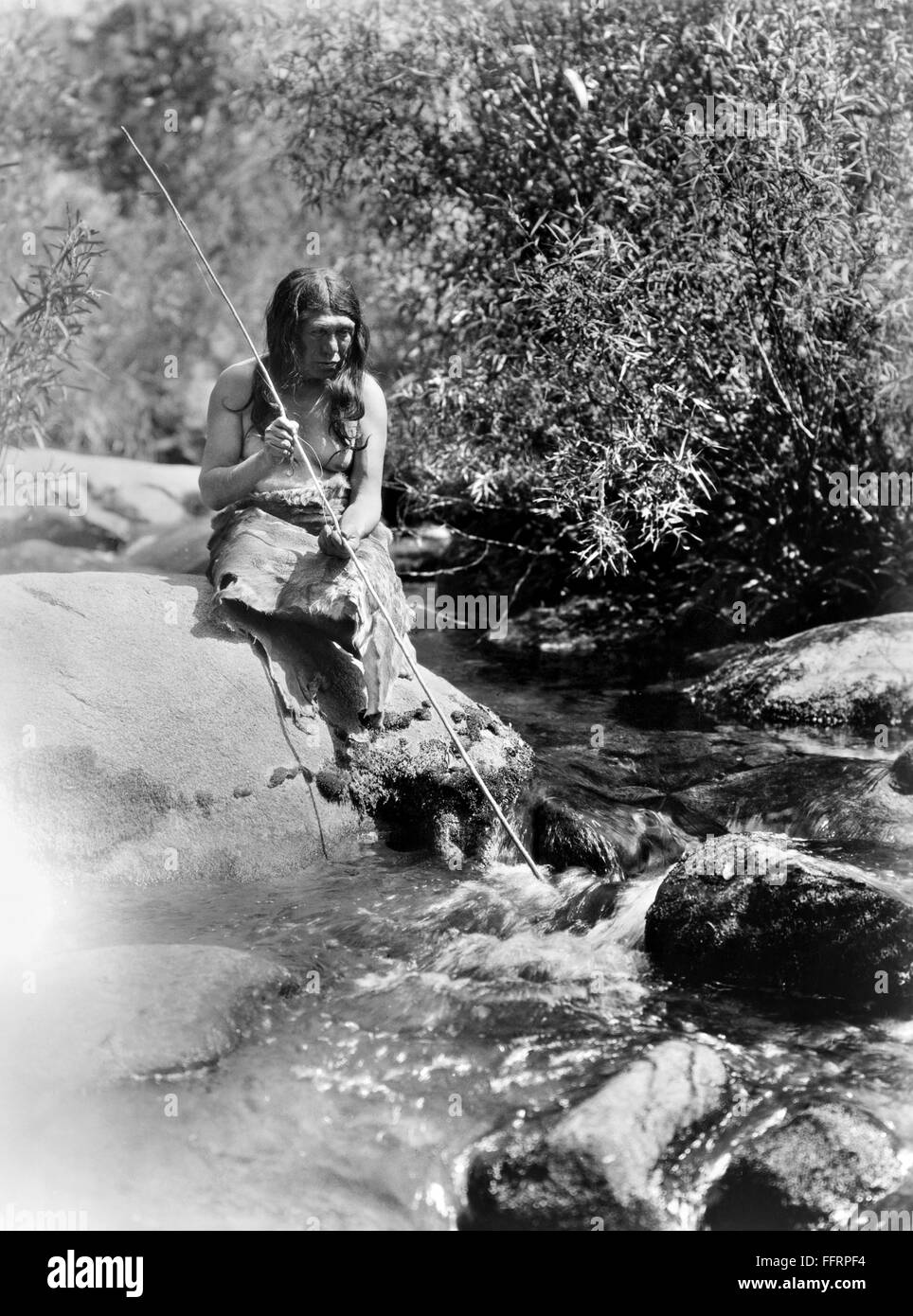 CALIFORNIA: MIWOK MAN, c1924. /nA Miwok man holding a fishing spear ...