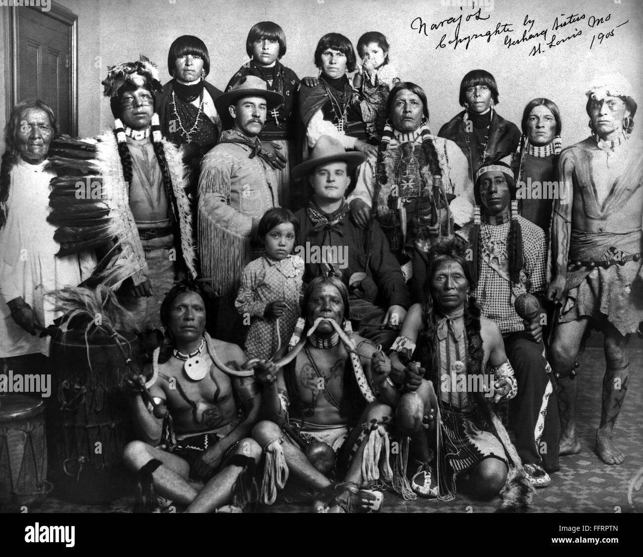 PUEBLO GROUP, 1904. /nA group of Pueblo Native Americans, three holding ...