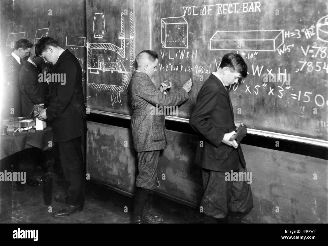 MATHEMATICS CLASS, 1916. /nYoung students at the blackboard in ...