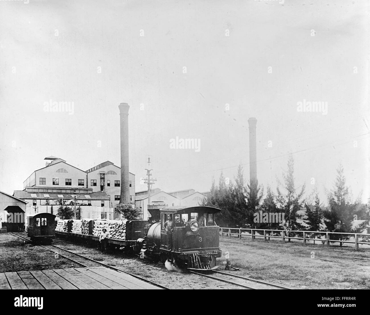 HAWAII: SUGAR MILL, c1915. /nA train filled with sacks of sugar leaving ...