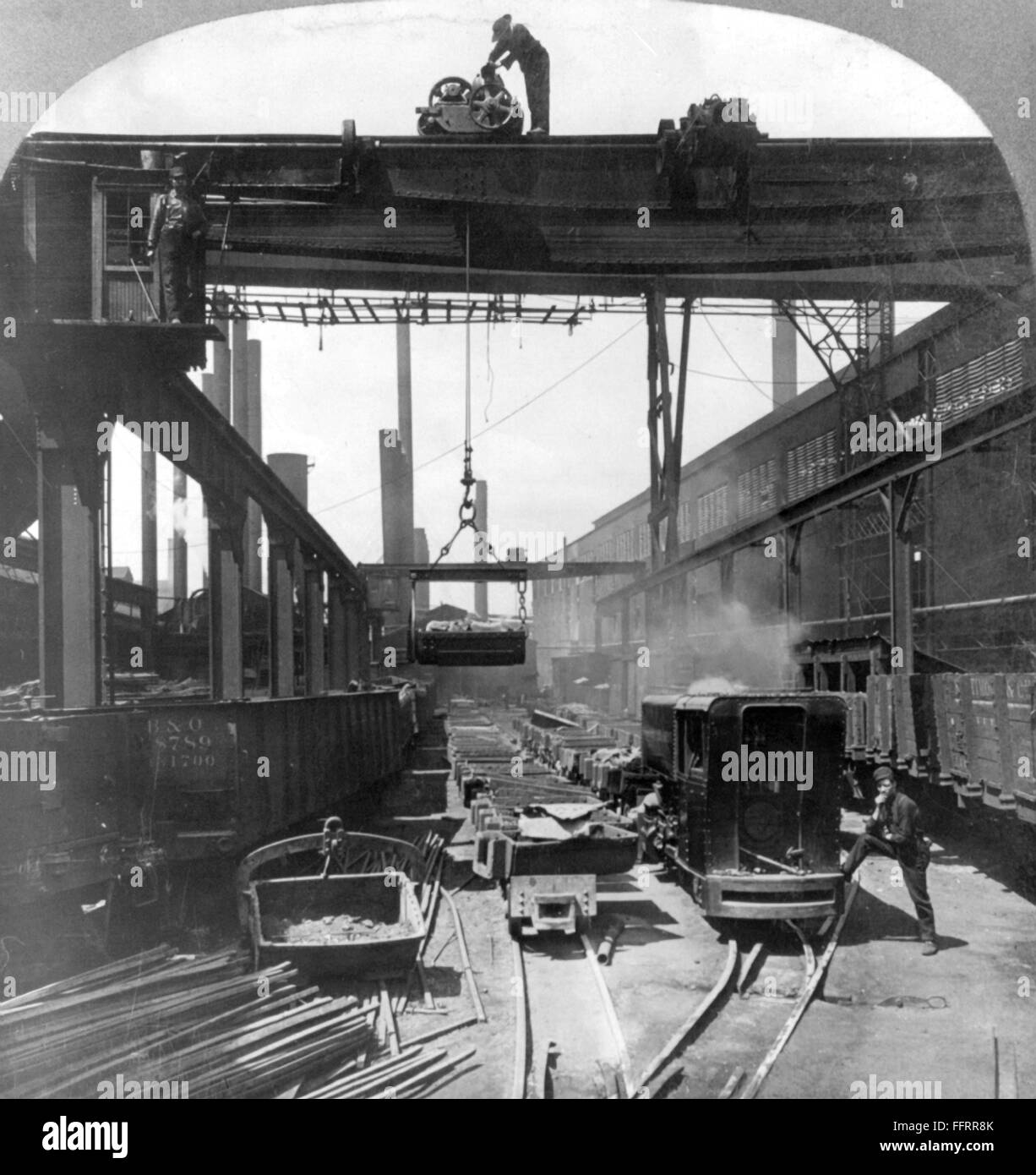 STEEL MILL, c1905. /nLarge cranes loading finished steel products into ...