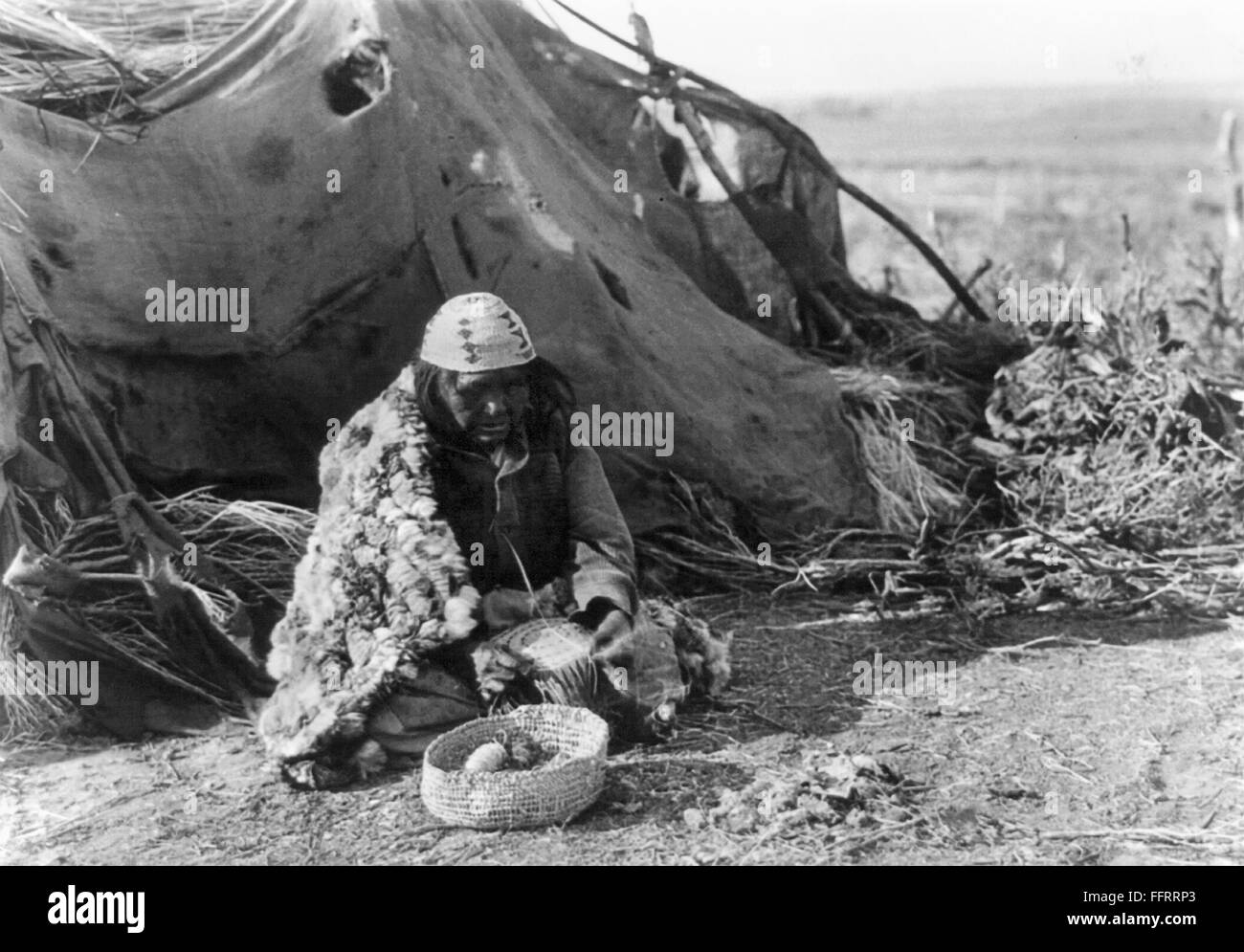 ACHOMAWI BASKET-MAKER, 1923. /nAn Achomawi Native American man, wearing ...
