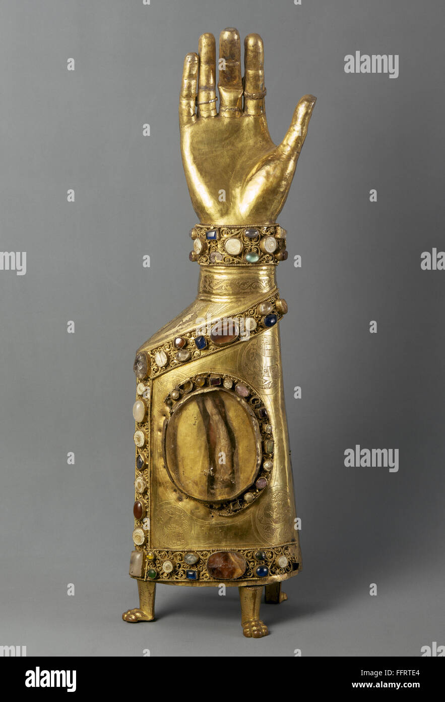 MEDIEVAL RELIQUARY. /nGold reliquary in the shape of an arm and hand ...