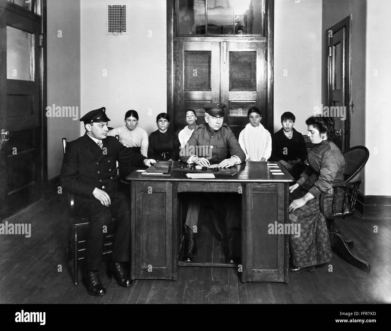 ELLIS ISLAND: IMMIGRANTS. /nEllis Island officials questioning ...