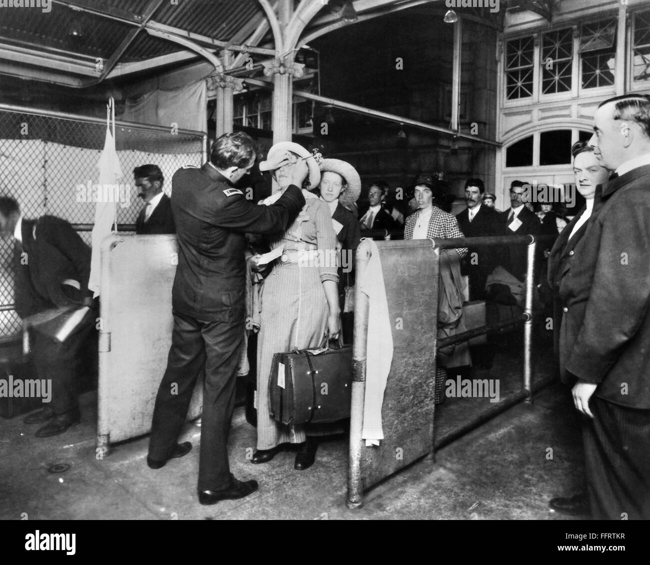 ELLIS ISLAND: EXAMINATIONS. /nImmigrants at Ellis Island being examined ...
