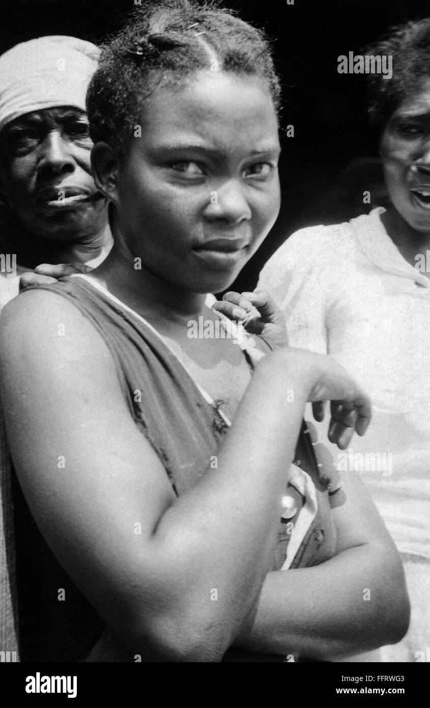 SUGAR MILL WORKER, 1934. /nA baptist woman at the Alma plantation ...