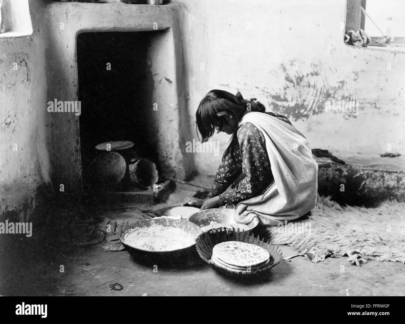 ZUNI BREAD MAKER, c1903. /nA Zuni woman making bread at a pueblo in New ...