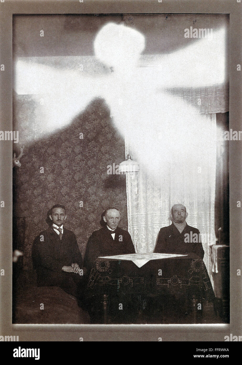 SPIRIT PHOTOGRAPH, c1900. /nThree men with a ghostly apparition above ...