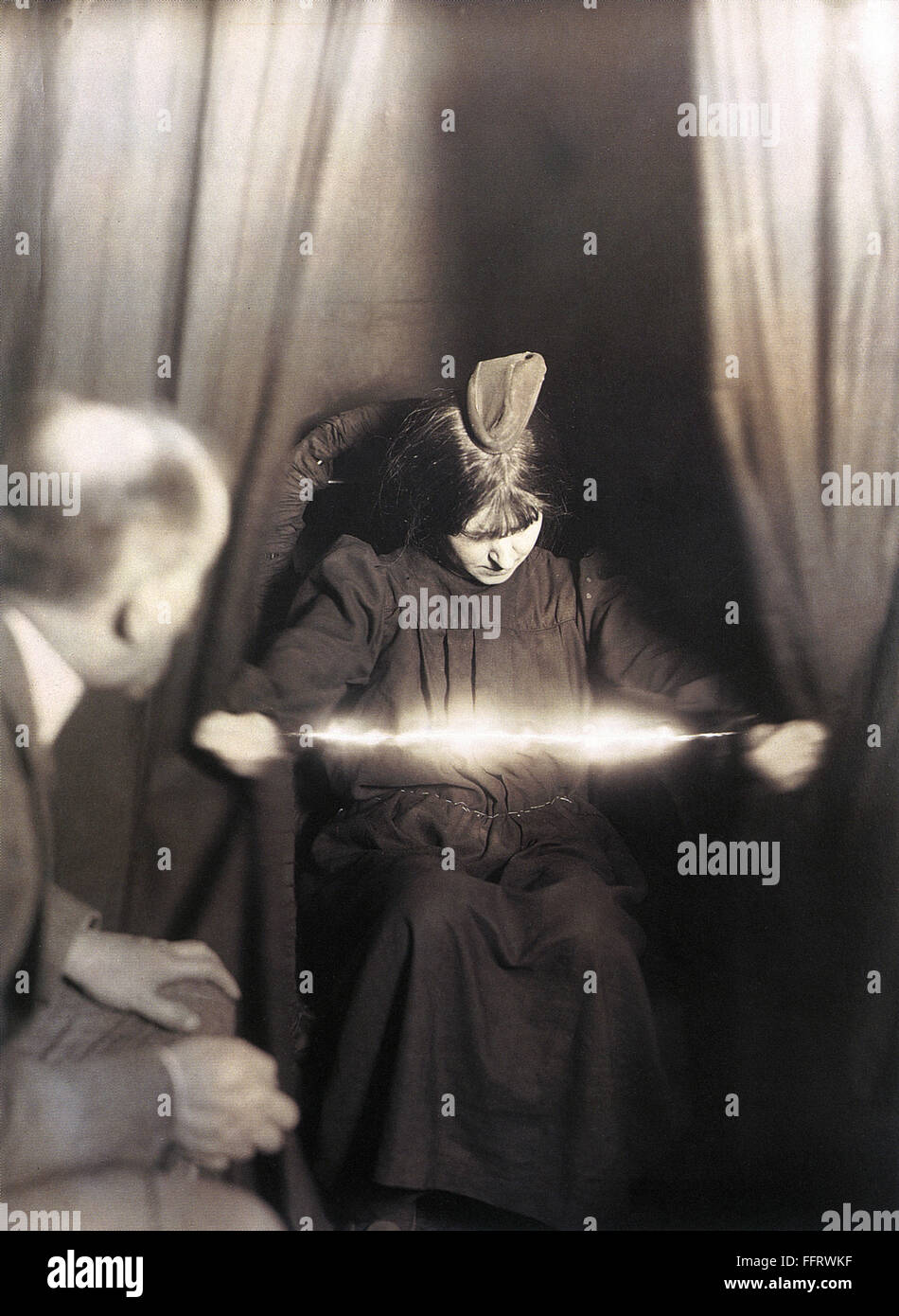 MEDIUM DURING S╔ANCE, 1912. /n'The medium Eva C. with a materialization ...