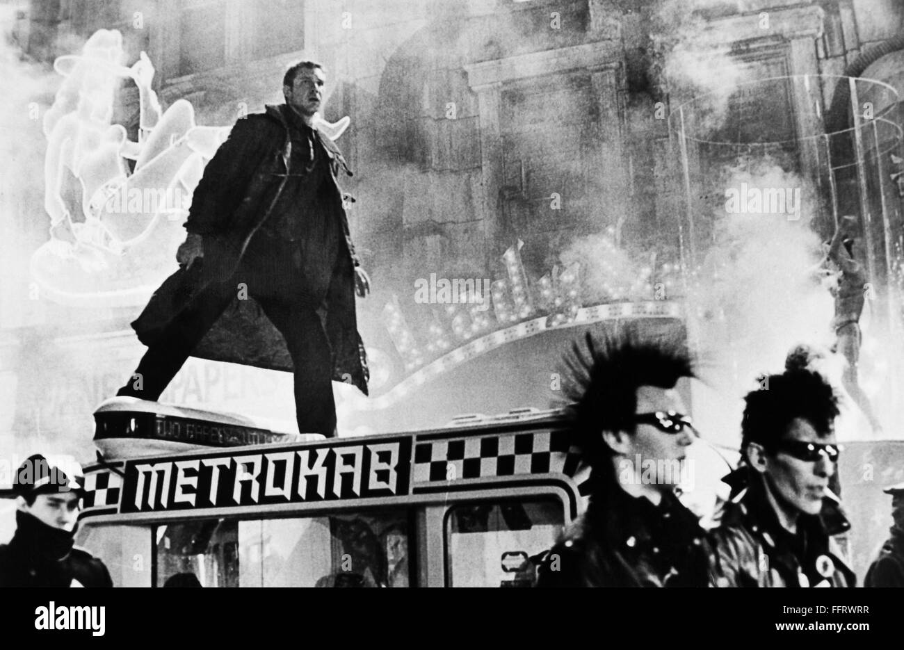 BLADE RUNNER, 1982. /nHarrison Ford (standing) in a scene from the film ...