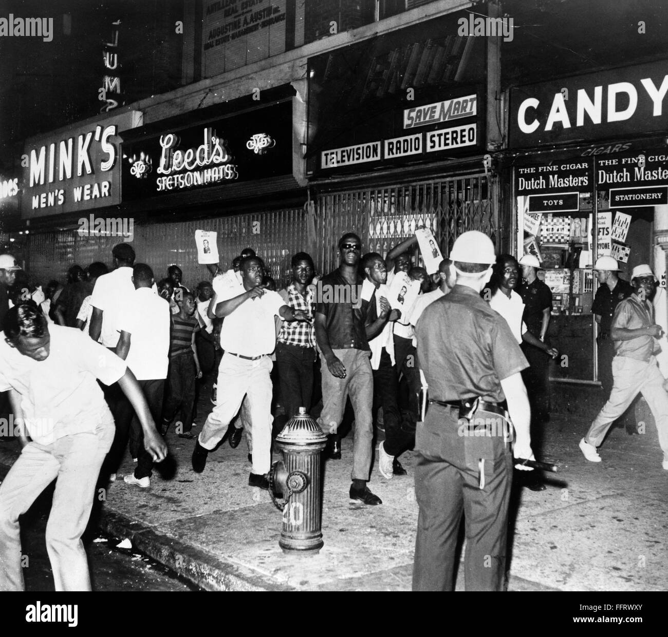 HARLEM: RACE RIOT, 1964. /nRioters march through Harlem streets ...