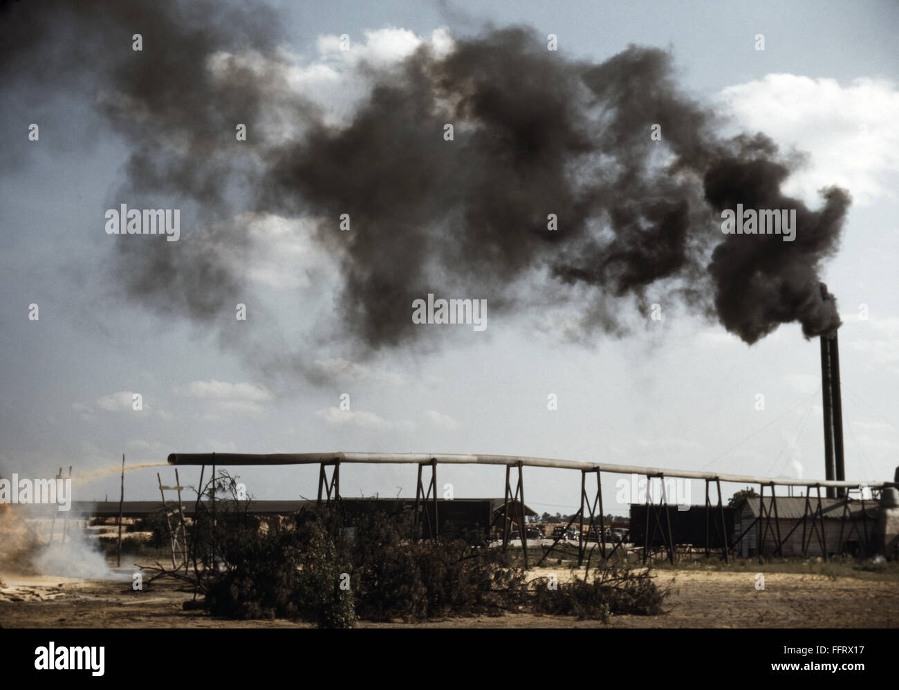 GEORGIA: SAW MILL, 1941. /nA long elevated pipe dripping fluid onto the ...