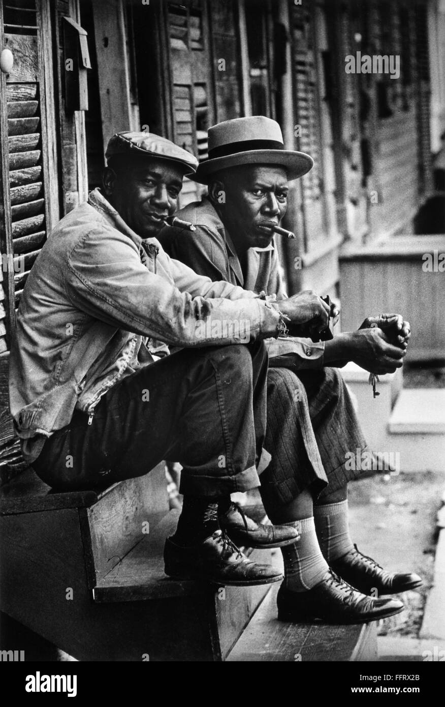 CHARLESTON: MEN ON STOOP, 1962. /nTwo African American men sitting on a ...