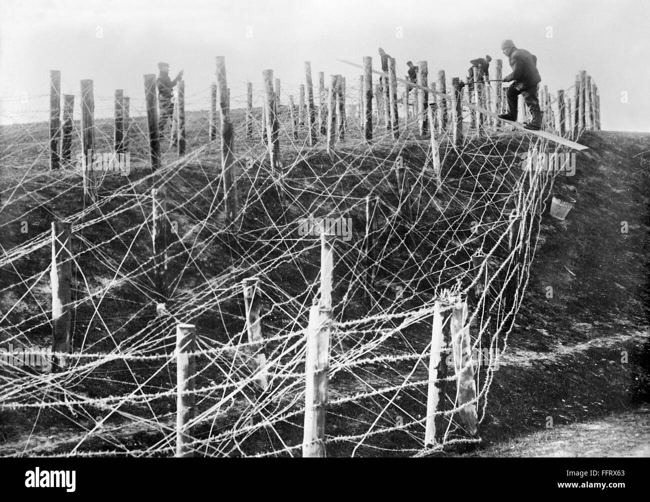 WORLD WAR I: BARBED WIRE. /nGerman soldiers fixing a barbed wire tangle ...