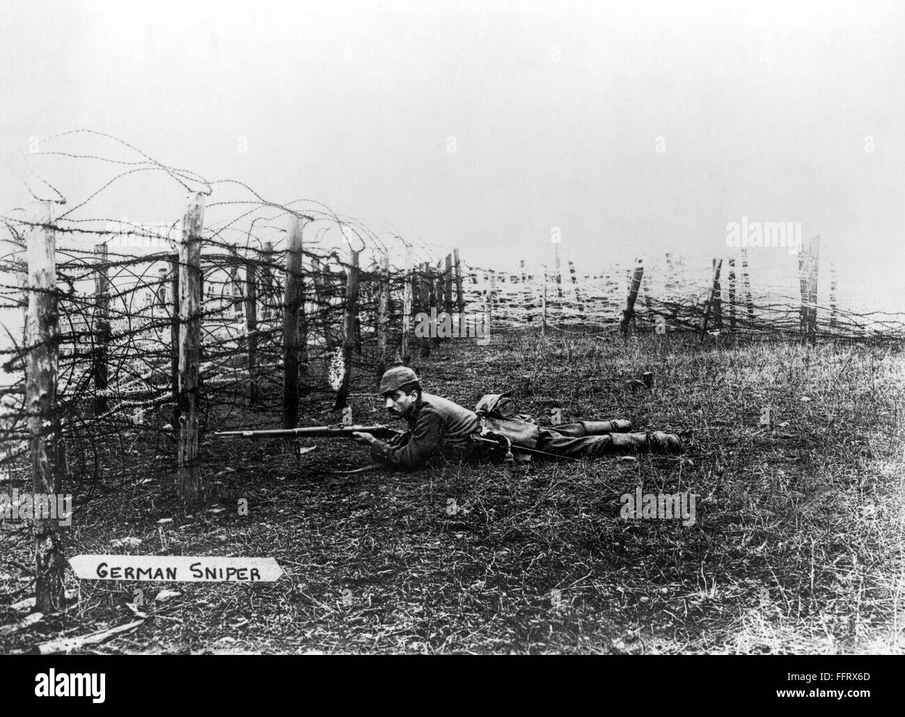 WORLD WAR I: SNIPER. /nA German sniper positioned on the ground behind ...