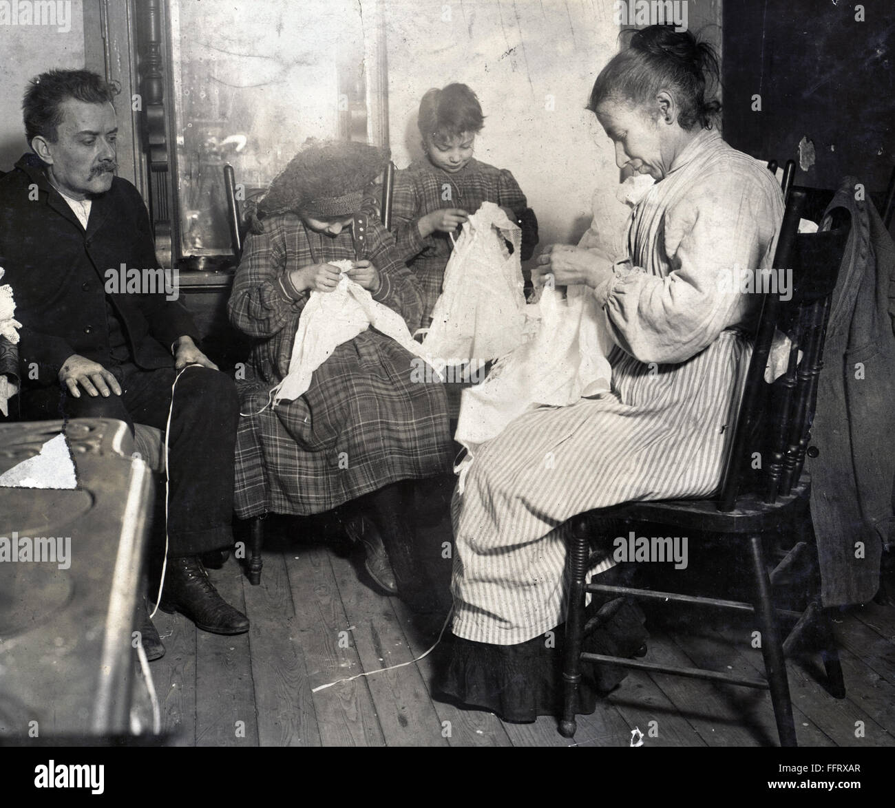 HINE: HOME INDUSTRY, 1910. /nFamily of garment sewers working from ...