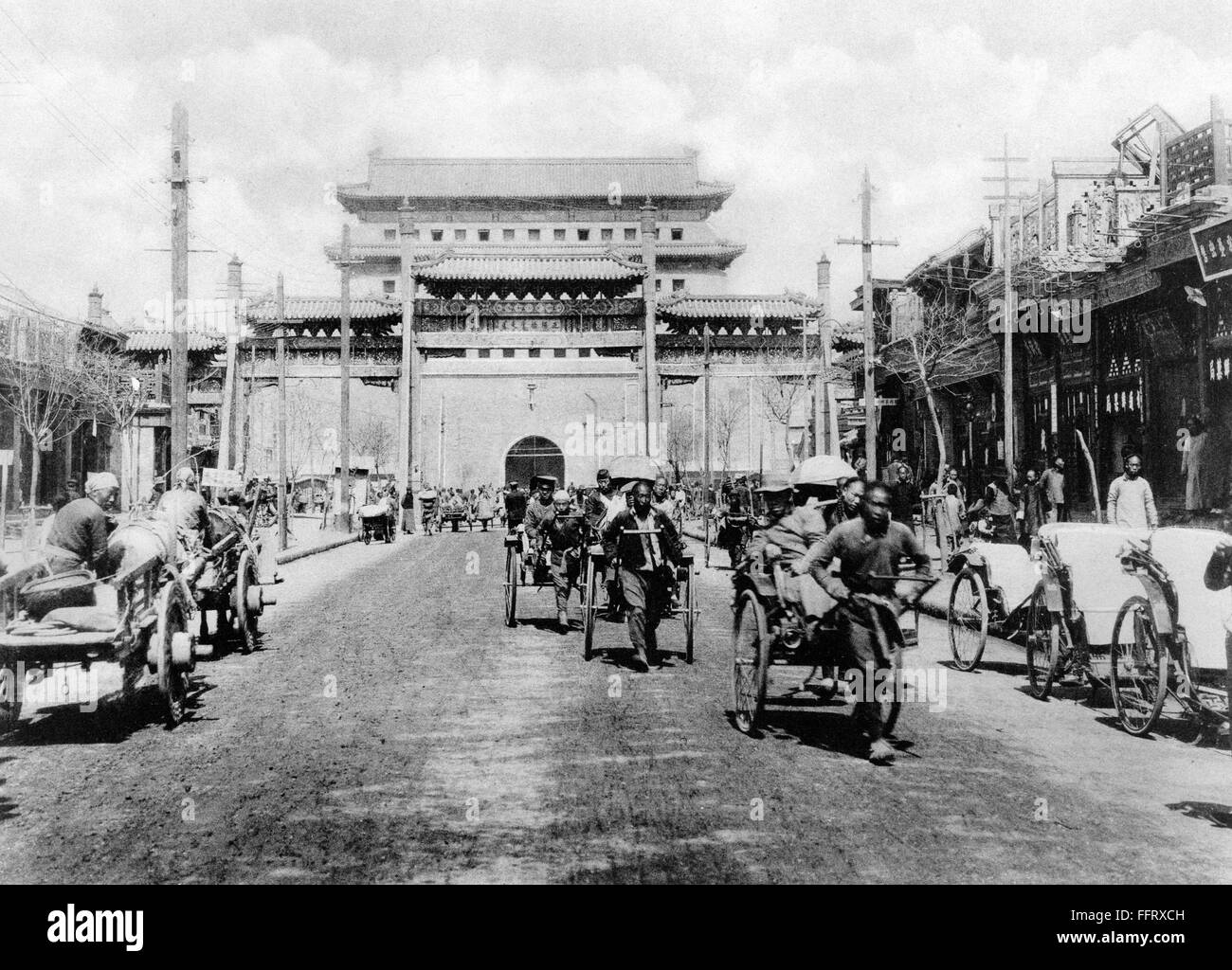 CHINA: PEKING, c1900. /nRickshaws, carts, and people on Chien-men ...