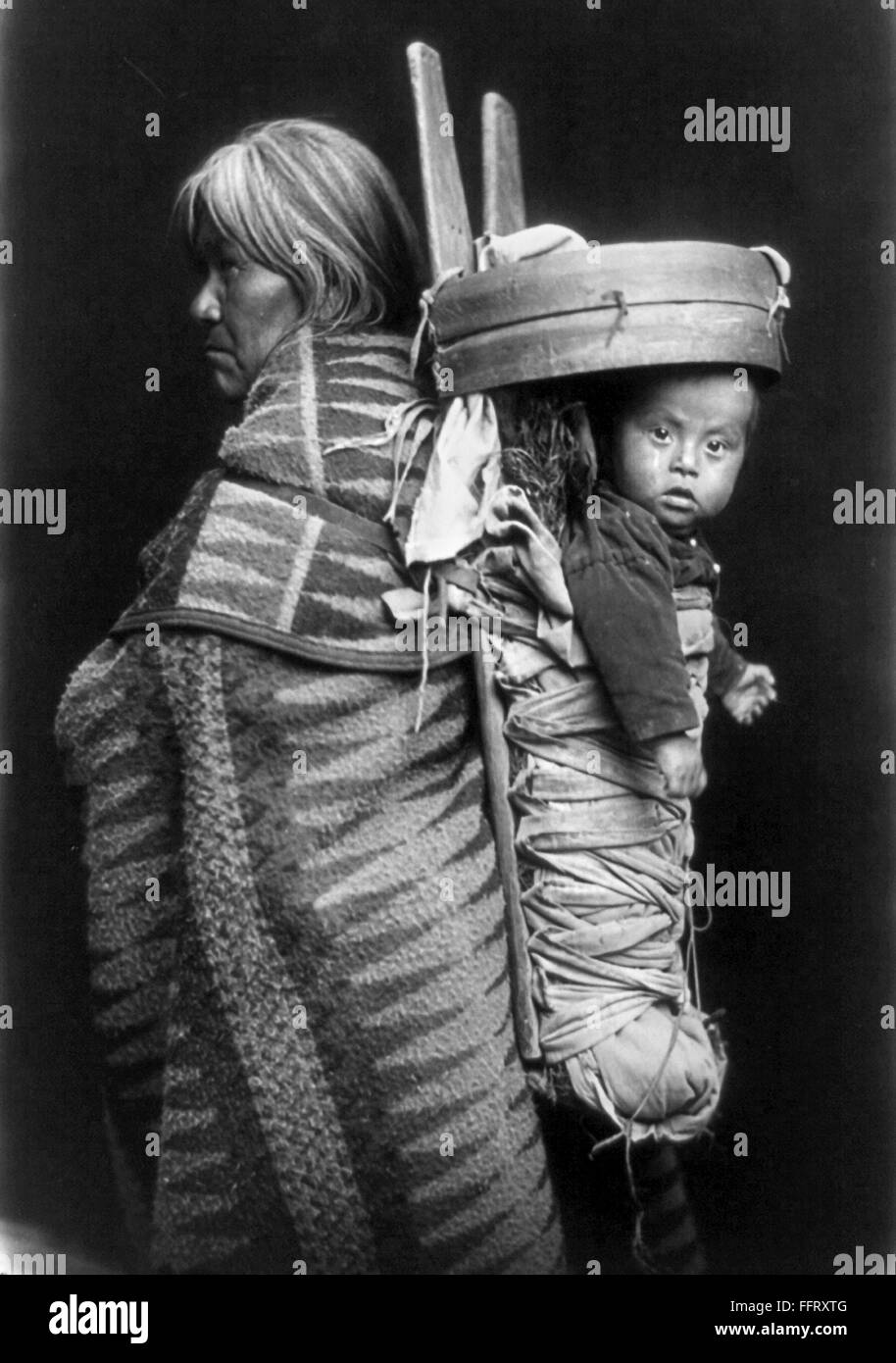 NAVAJO WOMAN & CHILD, c1914. /nA Navajo woman carrying an infant in a ... NAVAJO WOMAN & CHILD, c1914. /nA Navajo woman carrying an infant in a ...