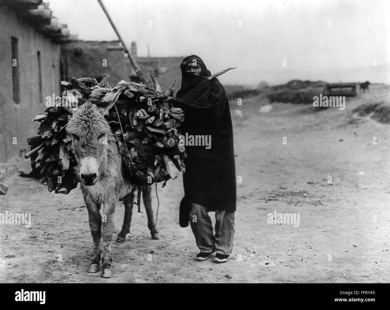 NEW MEXICO: ZUNI MAN, c1903. /nA Zuni man with a donkey carrying ...