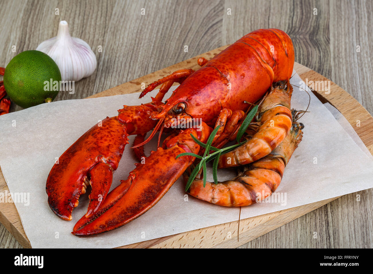 Big cooked lobster and tiger shrimps ready for eating Stock Photo - Alamy