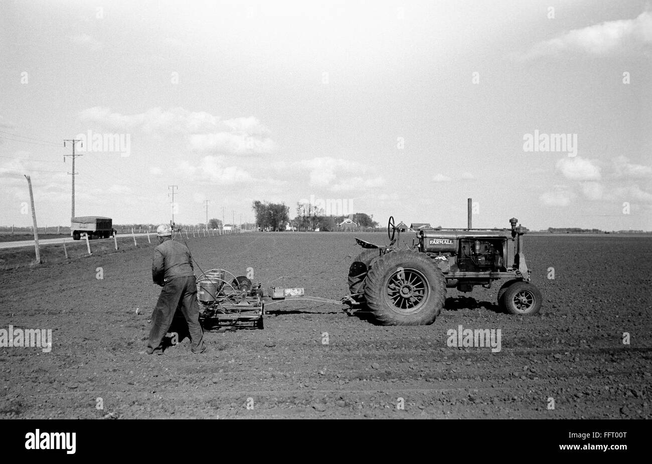 IOWA: TRACTOR, 1940. /nPlanting corn with a four-row tractor, Jasper ...