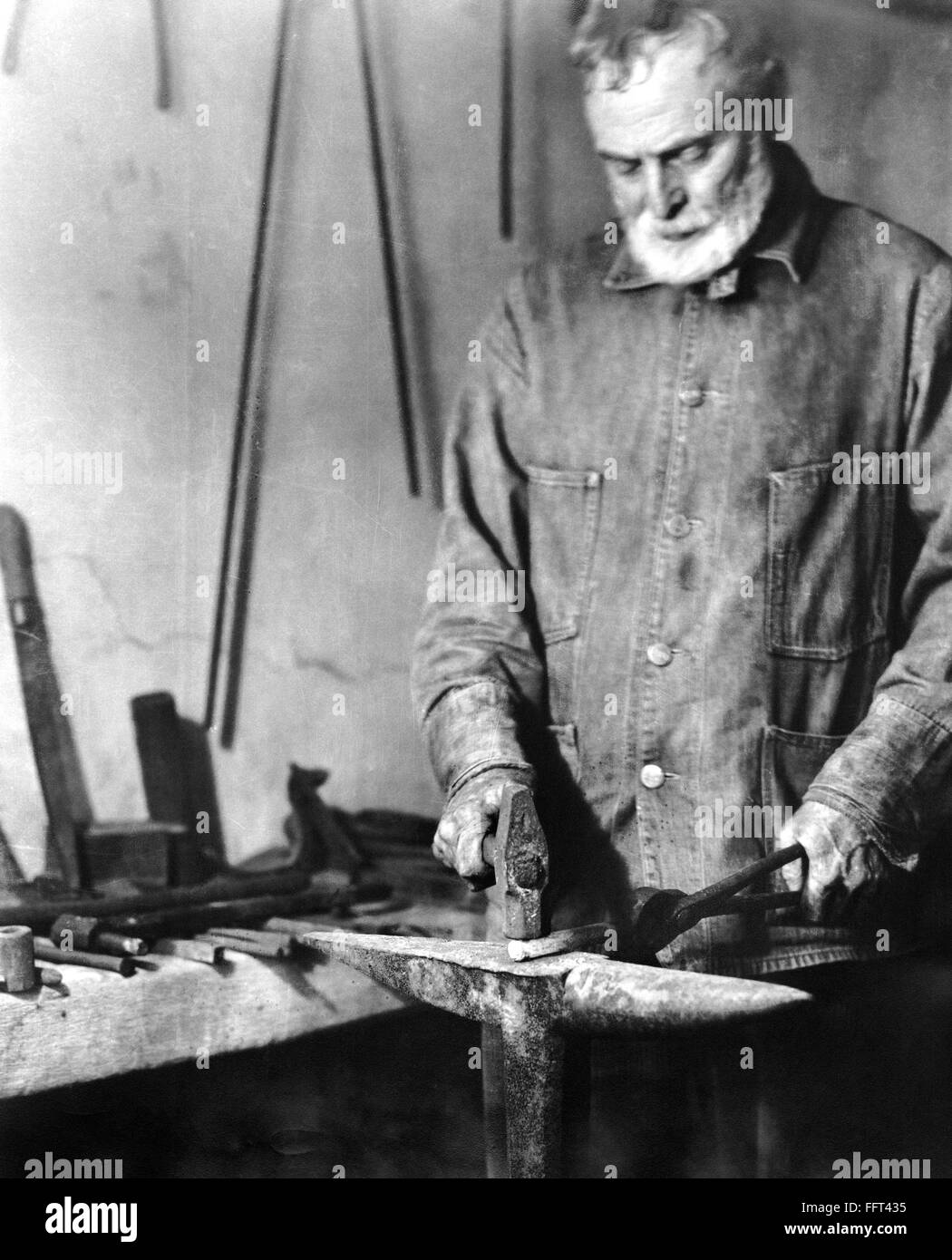 SHAKER BLACKSMITH, 1935. /nBrother Ricardo Belden blacksmithing at the ...