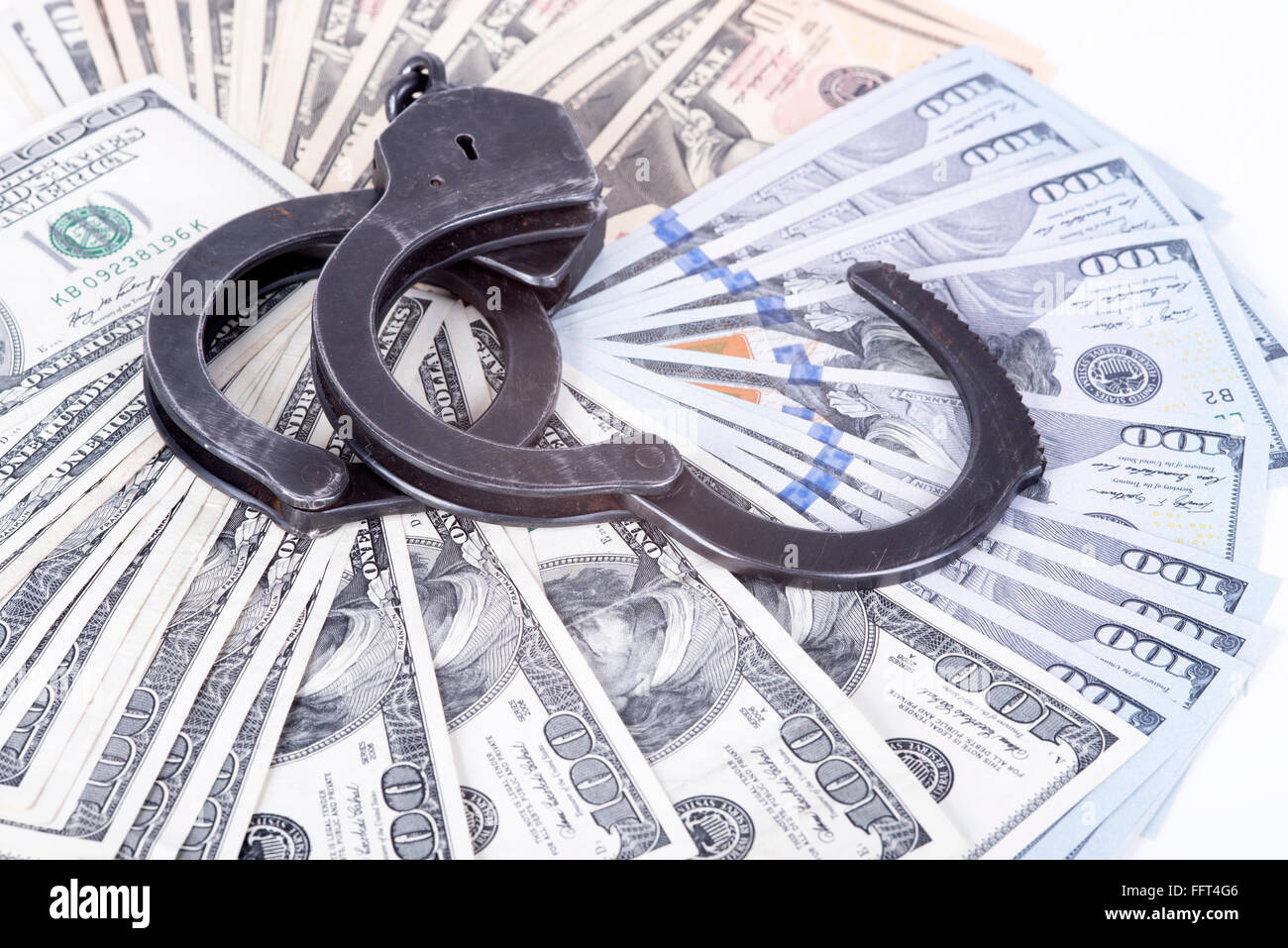photo showing money with handcuffs Stock Photo - Alamy