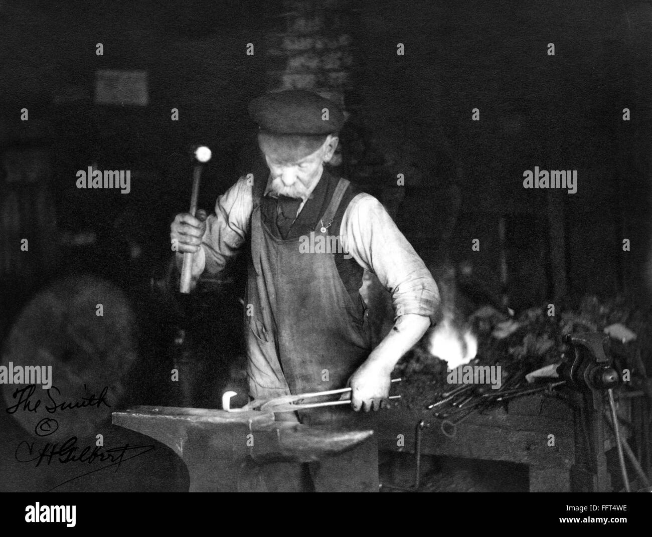 BLACKSMITH, c1910. /nAn American blacksmith at work in a shop ...