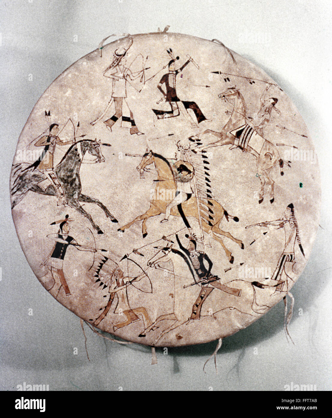 DAKOTA PAINTED DRUM. /nDakota Sioux buckskin shield, painted with a ...
