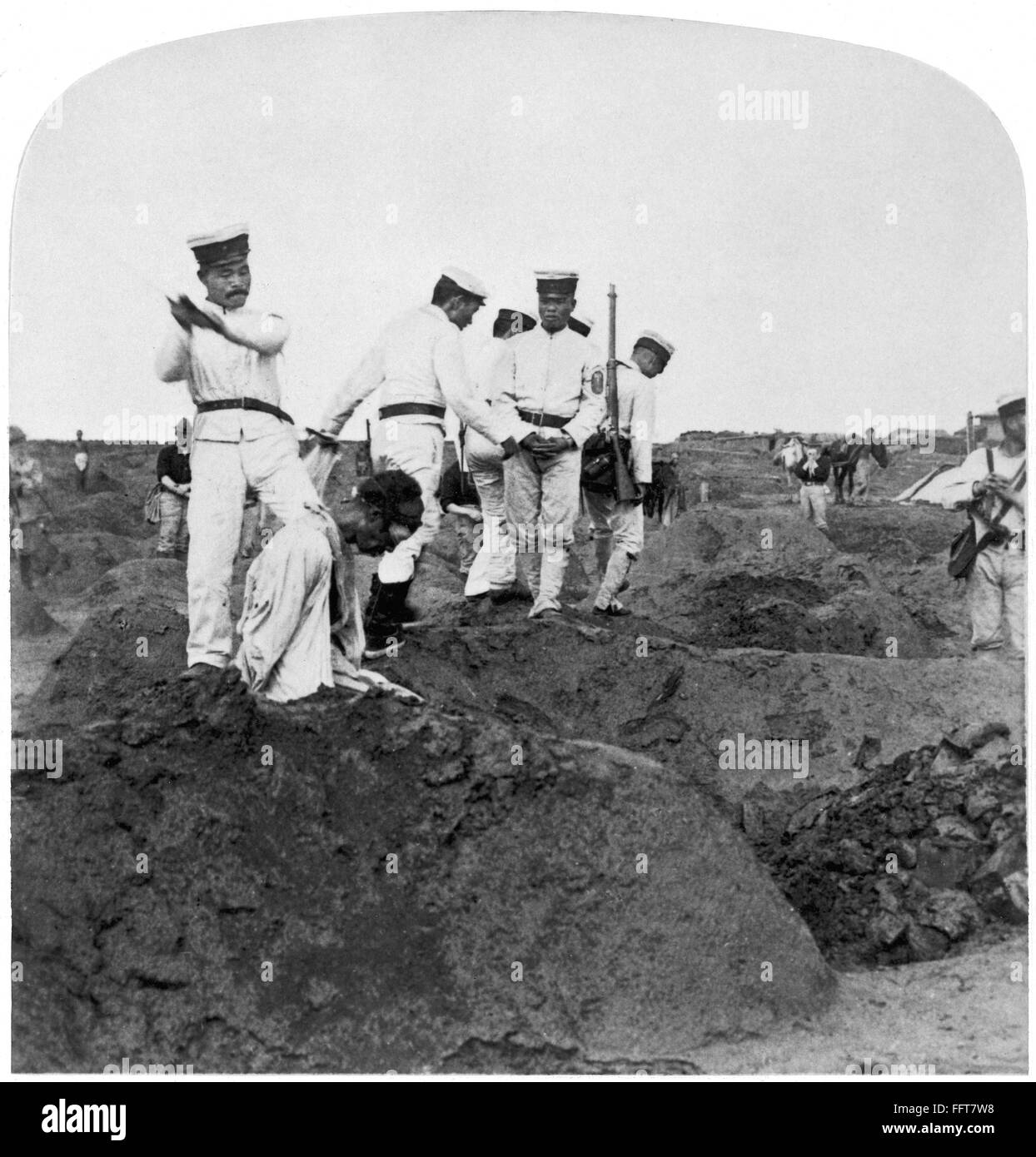 CHINA: BOXER REBELLION. /nA captured Boxer rebel kneeling before his ...