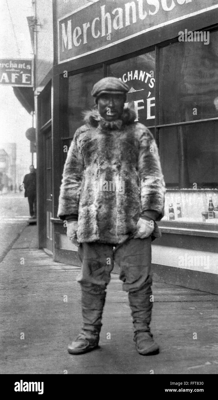 ALASKA: ESKIMO MAN. /nAn Eskimo man standing on a commercial street in ...