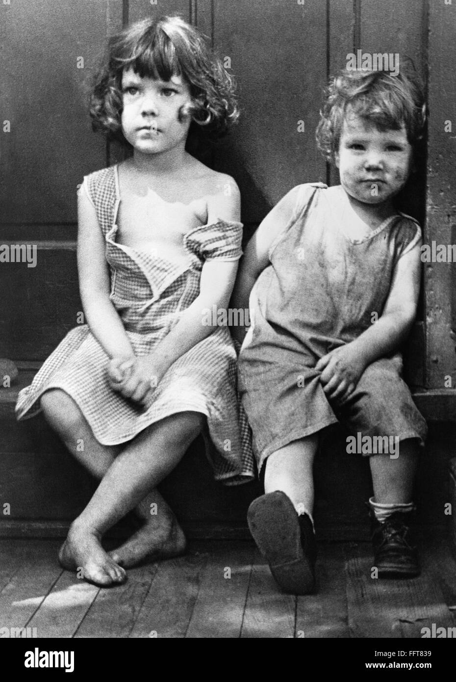 POVERTY: CHILDREN, 1935. /nTwo impovished children in the slum section ...
