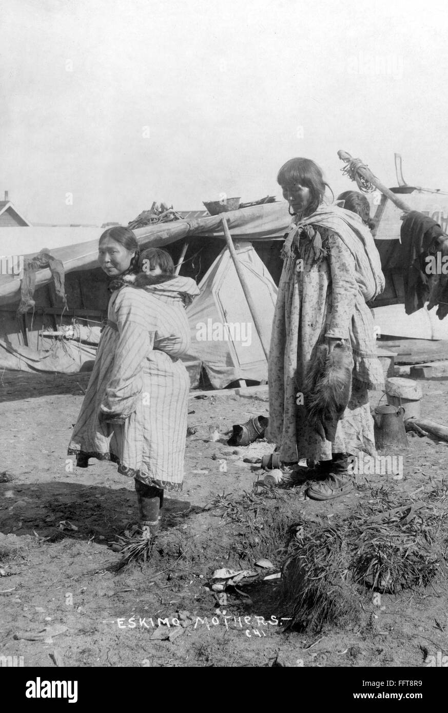 ALASKA: ESKIMOS, c1916. /nTwo Eskimo mothers standing outside their ...