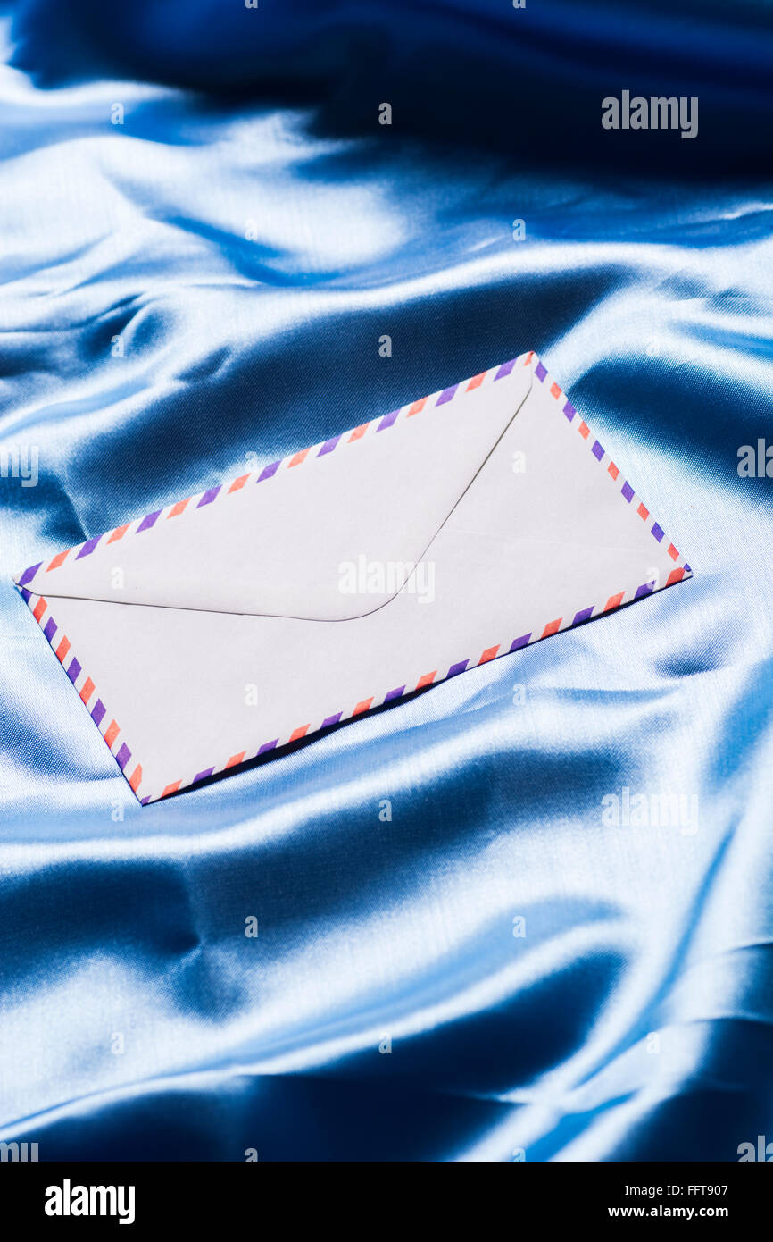 airmail envelope over blue silk Stock Photo - Alamy
