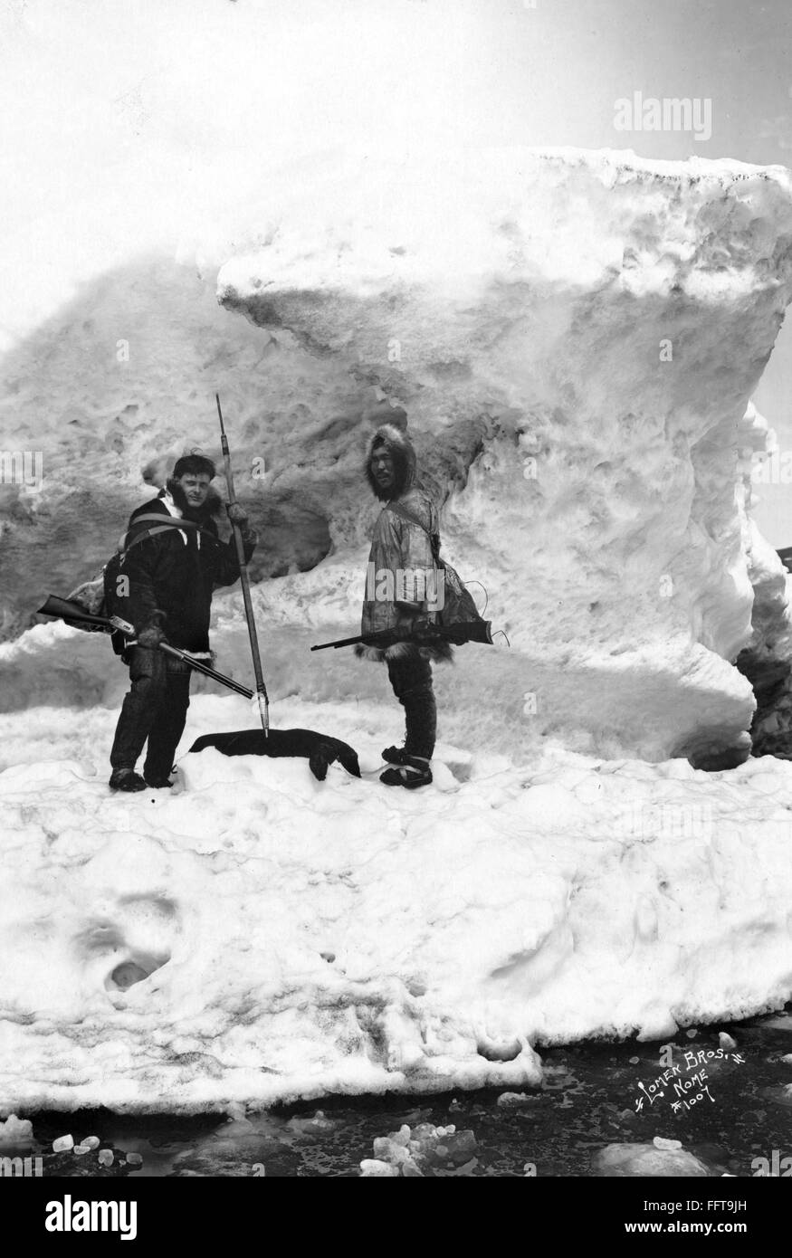 ALASKA: HUNTERS. /nAn Eskimo and another man hunting in winter in the ...