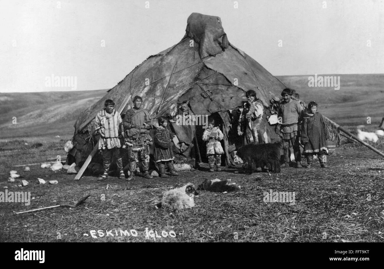 ALASKA: ESKIMO IGLOO. /nA group of Eskimos standing in front of their ...