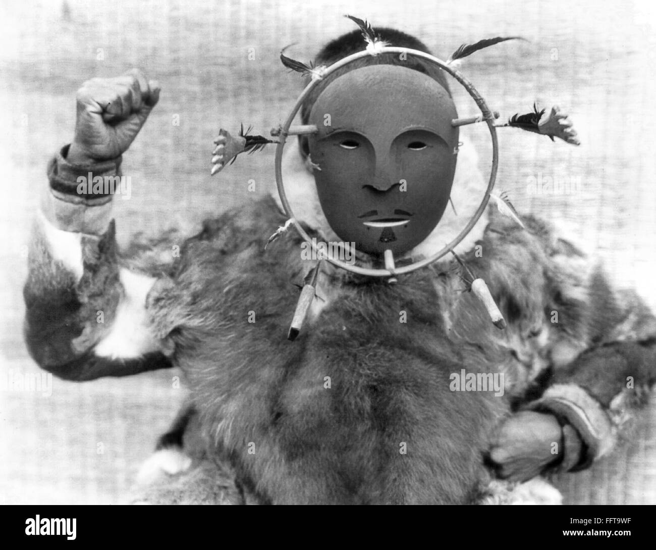 ALASKA: ESKIMO MASK, c1929. /nA Nunivak native wearing a ceremonial ...