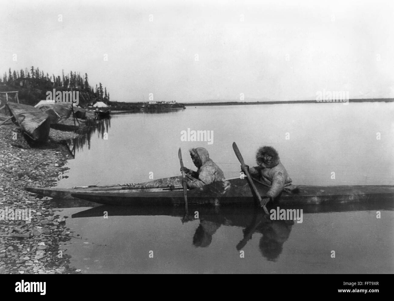 ALASKA: ESKIMOS, c1929. /nTwo Eskimo men in a kayak in the village of ...