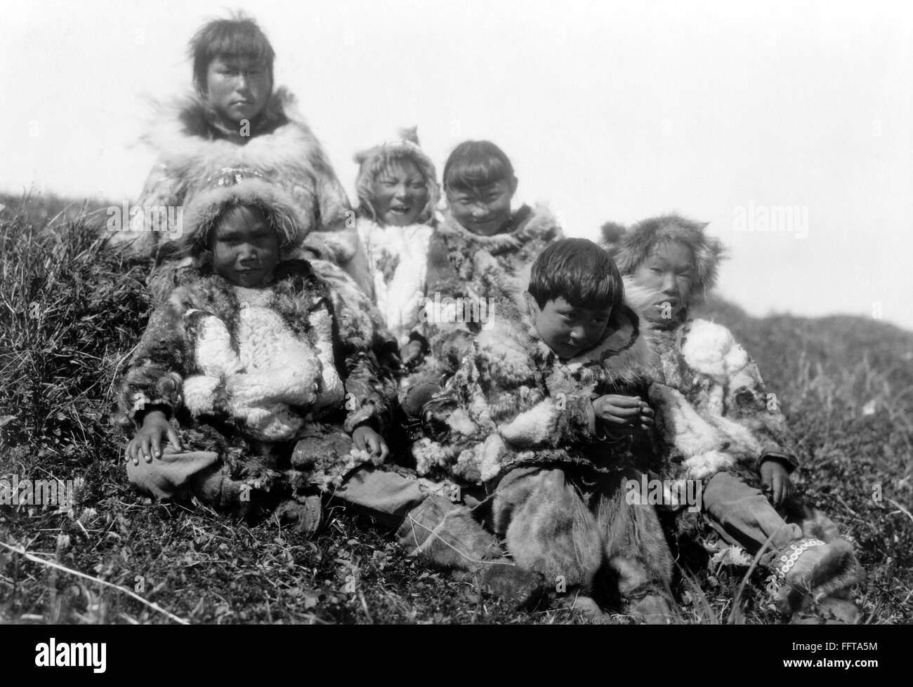 ESKIMO CHILDREN, c1929. /nA group of six Eskimo children sitting on a ...