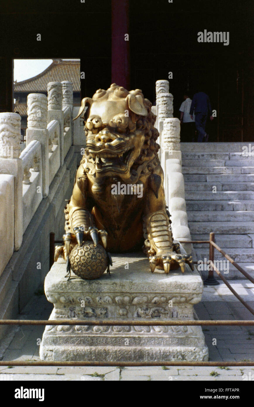 PEKING: FOO DOG. /nGilded bronze male foo dog guarding an entrance at ...