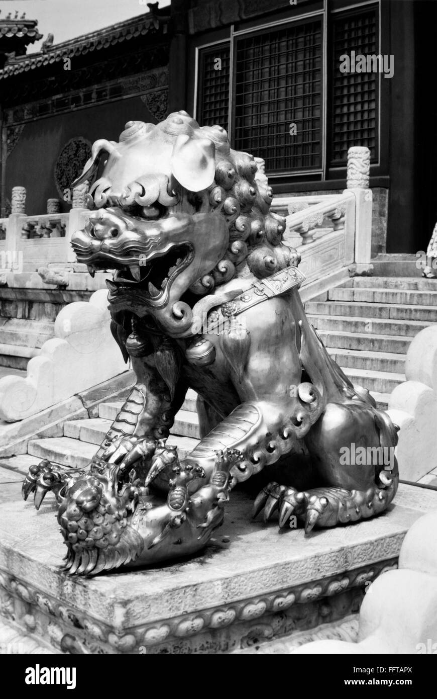 PEKING: FOO DOG. /nGilded bronze female foo dog guarding an entrance at ...