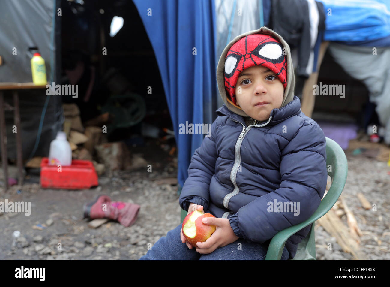 Portrait of a refugee boy (5 years) from Syria eating an apple, now ...