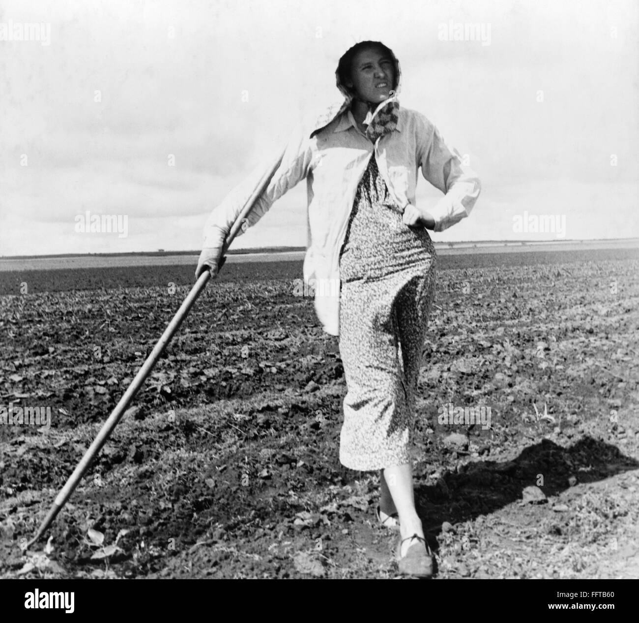 TEXAS: FARM WIFE, 1937. /nWife of a Texas tenant farmer hoeing the soil ...