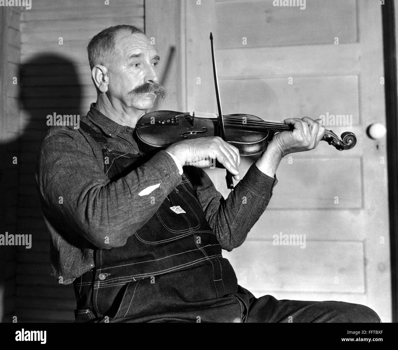 VIRGINIA: FIDDLER, 1934. /nDavy Crockett Ward, a fiddler with the Bog ...