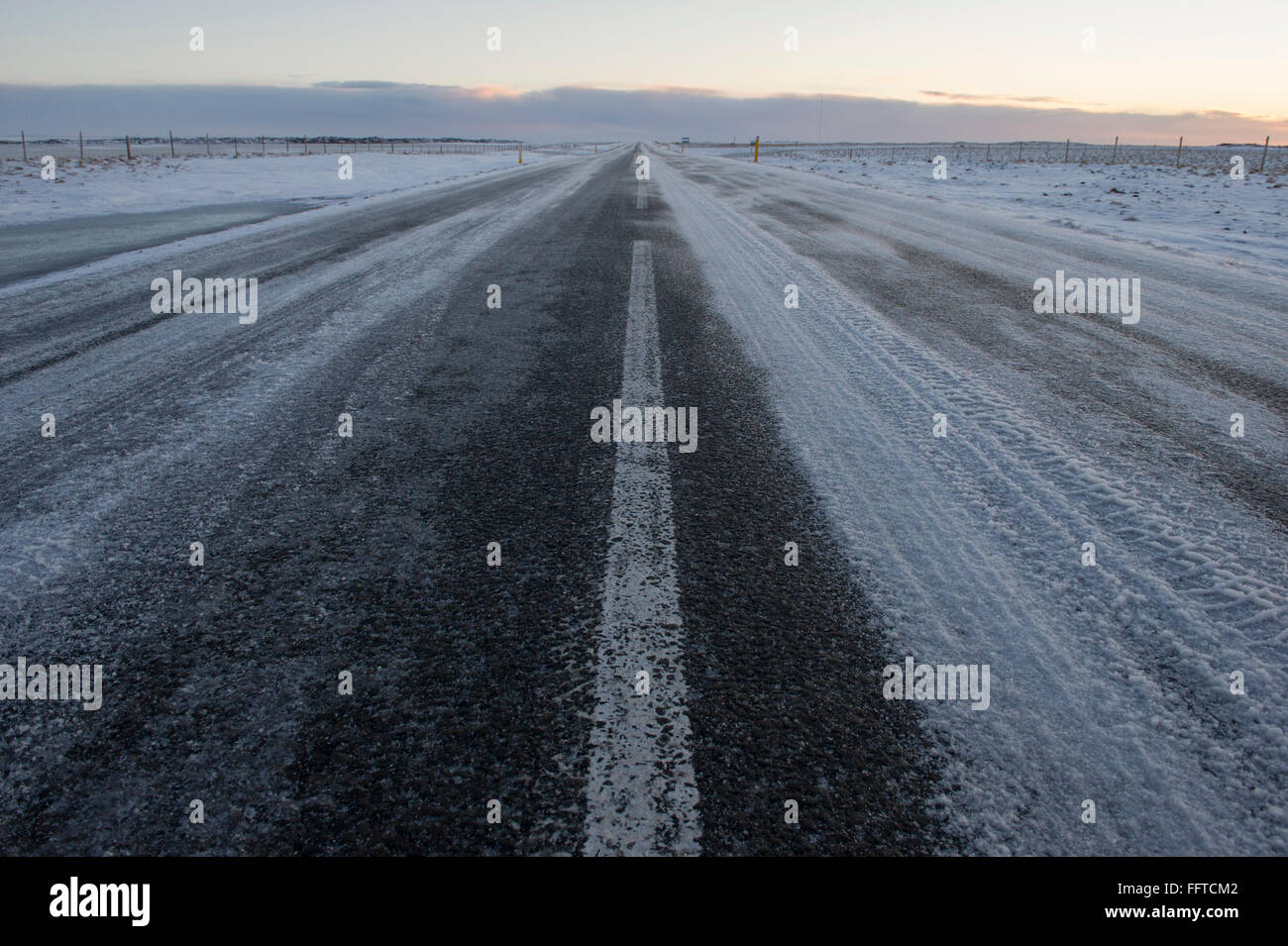 A road covered with ice and snow on the Snaefellsnes Peninsula in ...