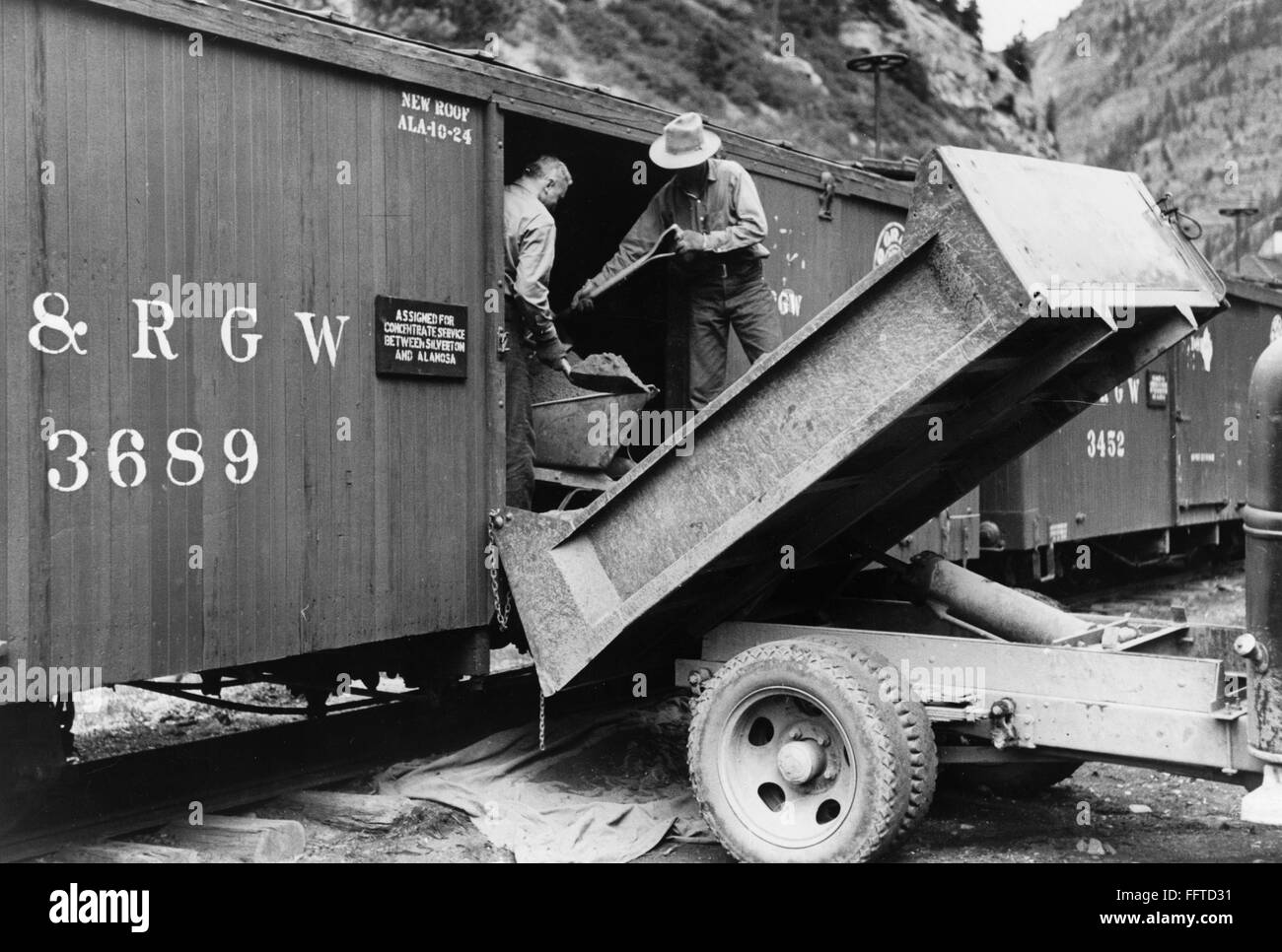 FREIGHT CAR, 1940. /nWorkers loading gold ore concentrate into a ...