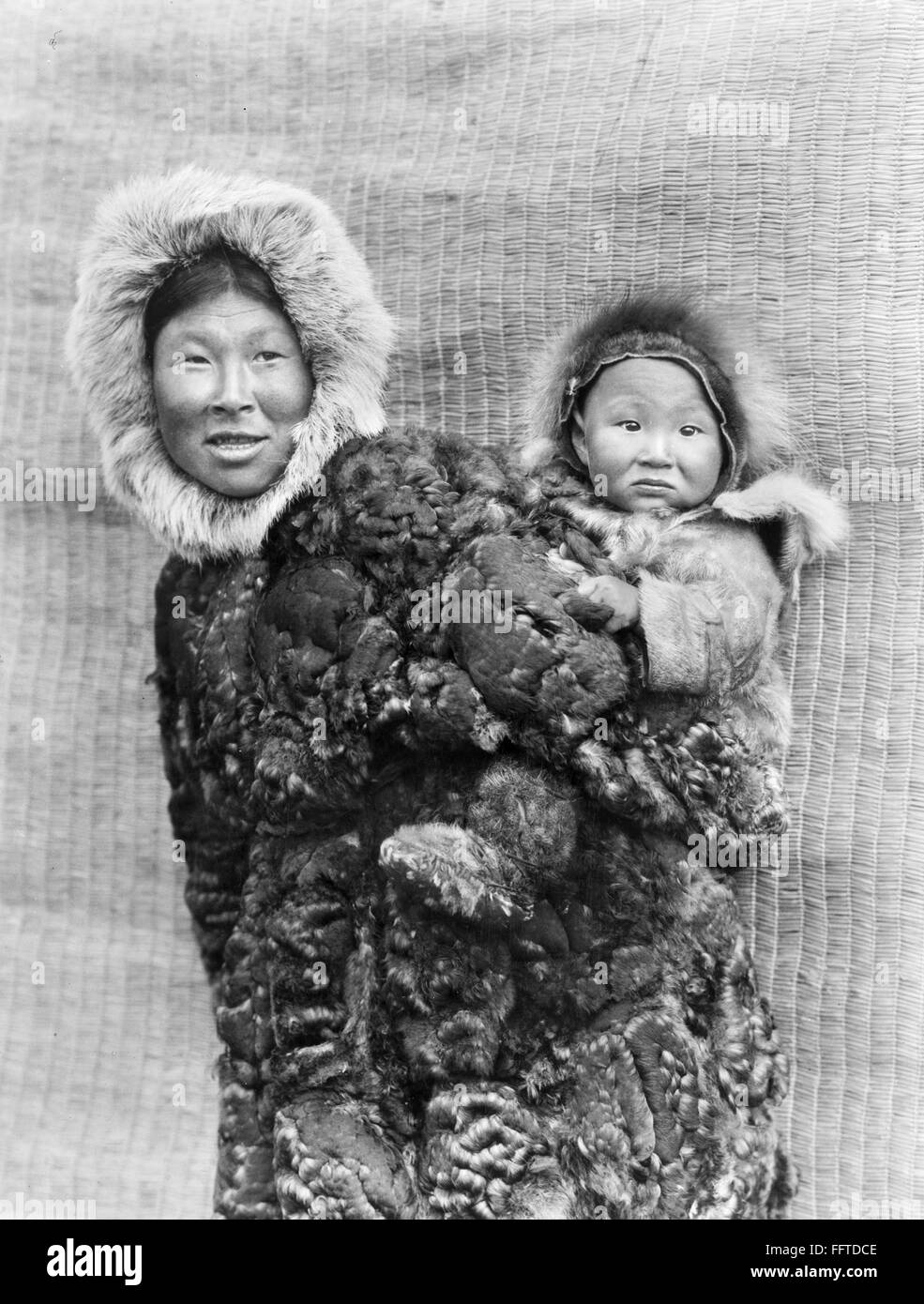 ALASKA: ESKIMOS, c1929. /nAn Eskimo mother carrying a child, identified ...